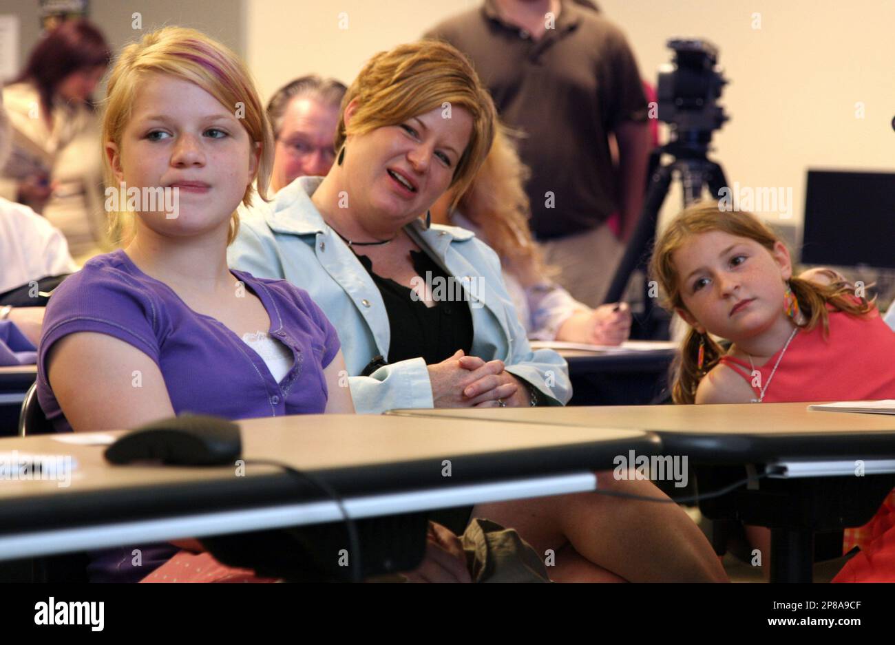 Heather Gengler, center, wife of U.S. Army Reserve Maj. Miles Gengler ...