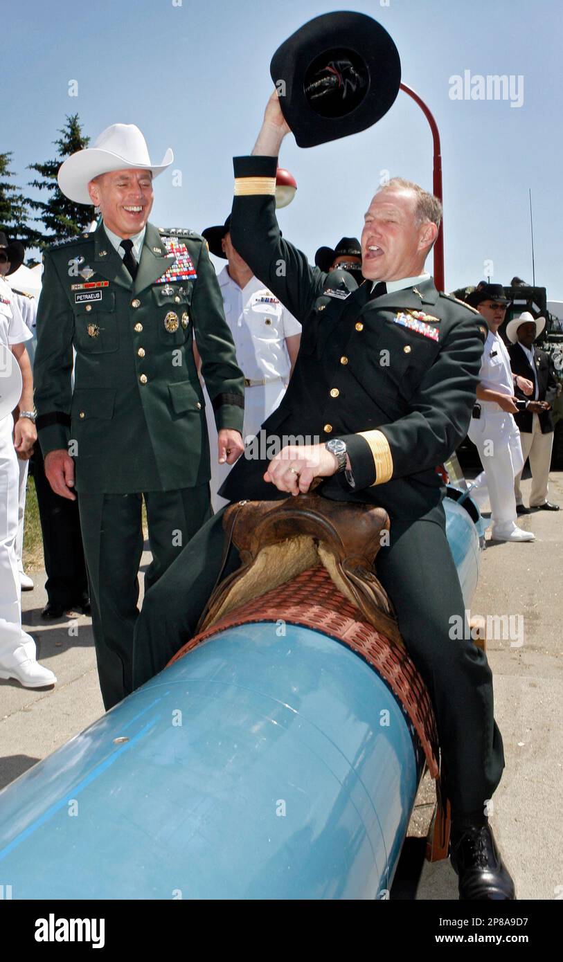 Gen. Walter Natynczyk, right, Chief of Defence Staff, rides a torpedo ...