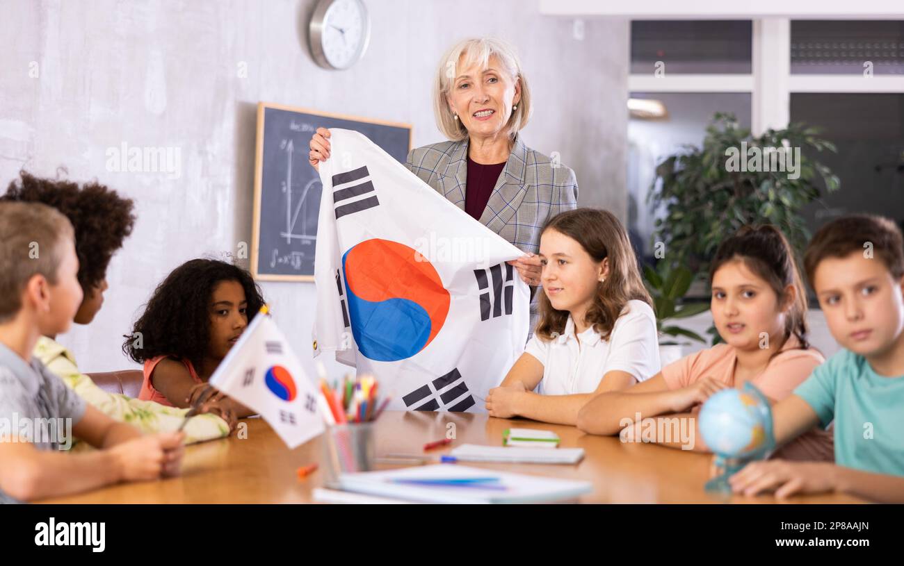 Mature woman teacher tells hi-res stock photography and images - Alamy