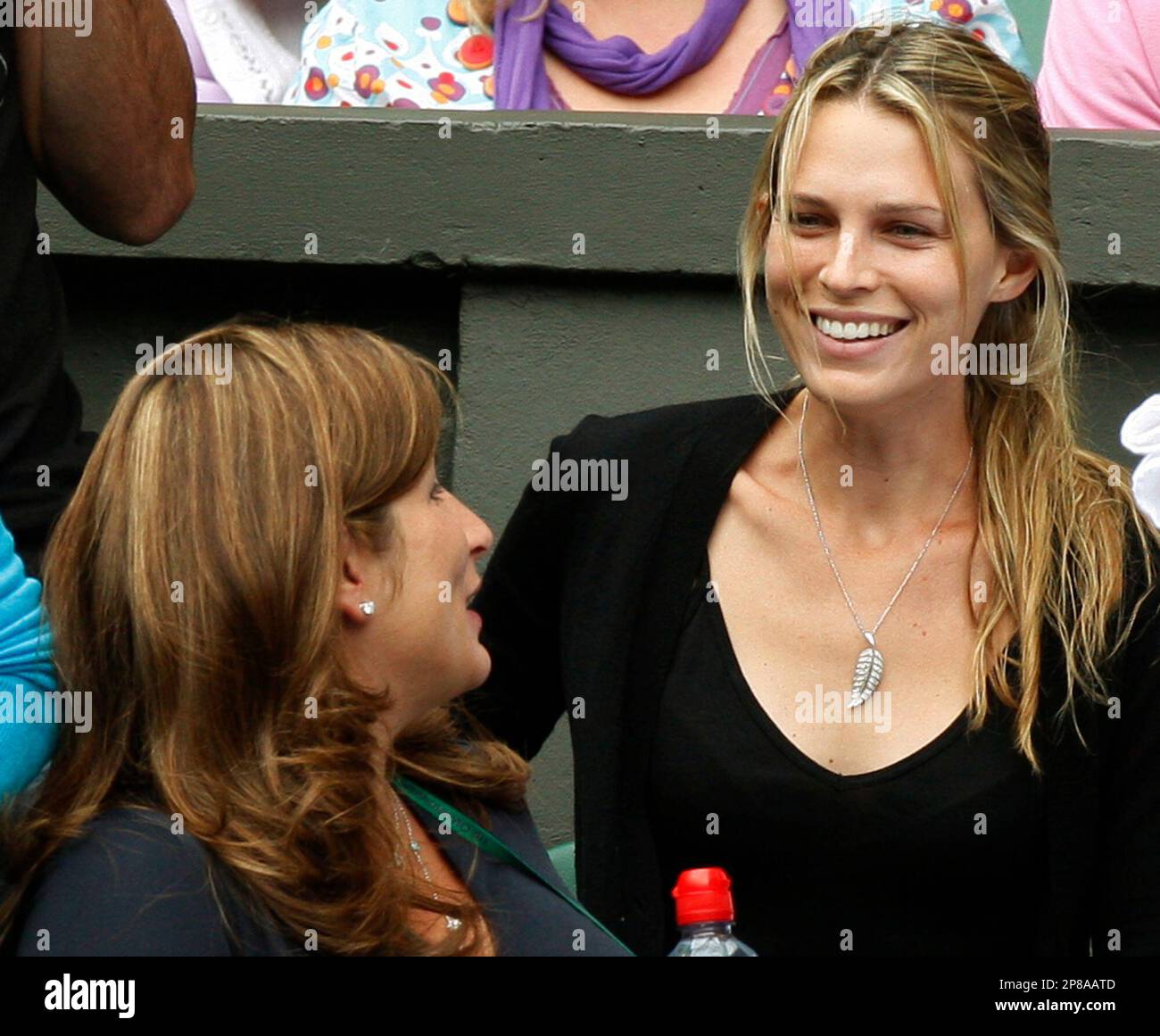 Roger Federer's wife Mirka, left. chats with US actress Sara Foster ...