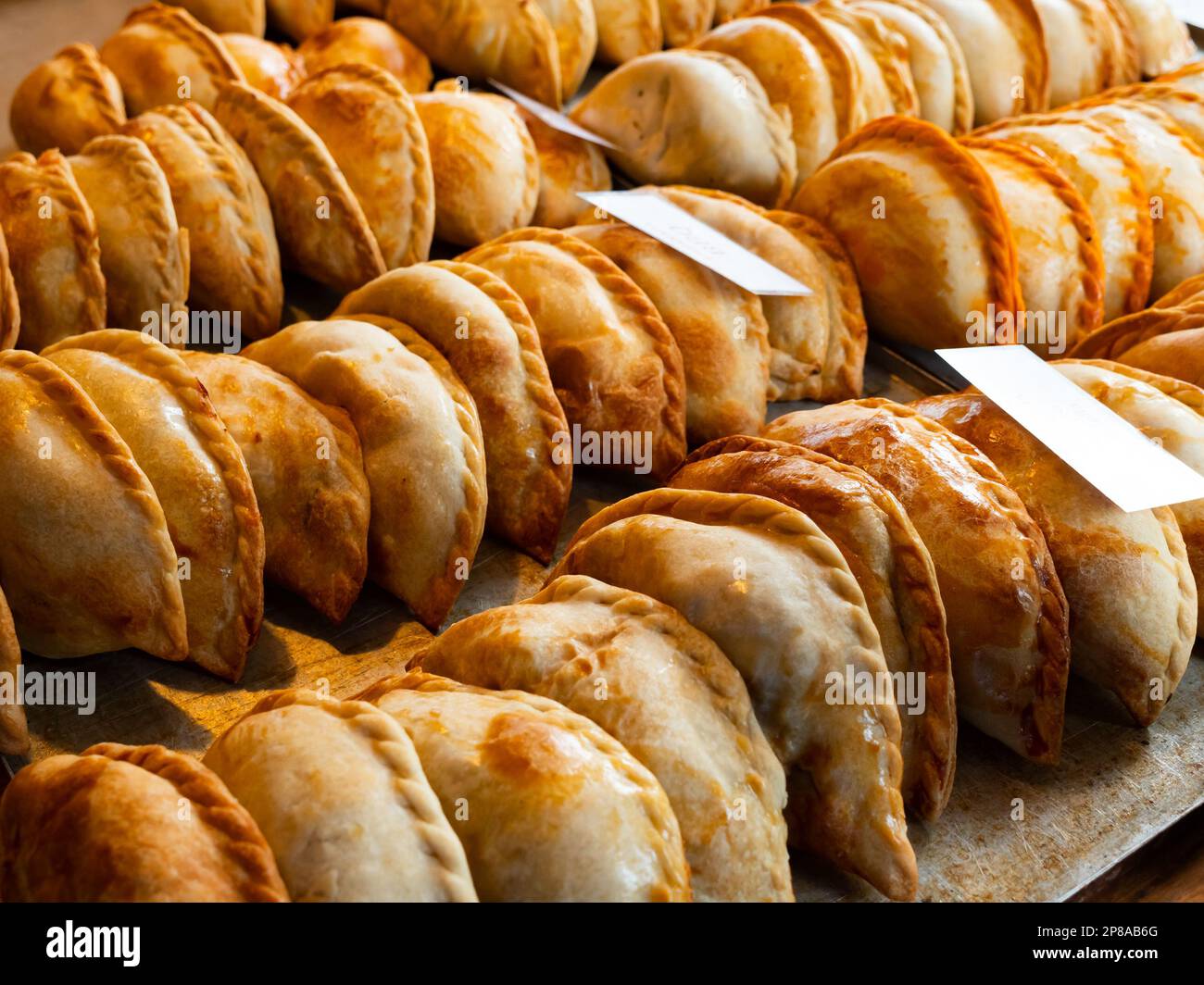 Baked snack empanada at market Stock Photo - Alamy