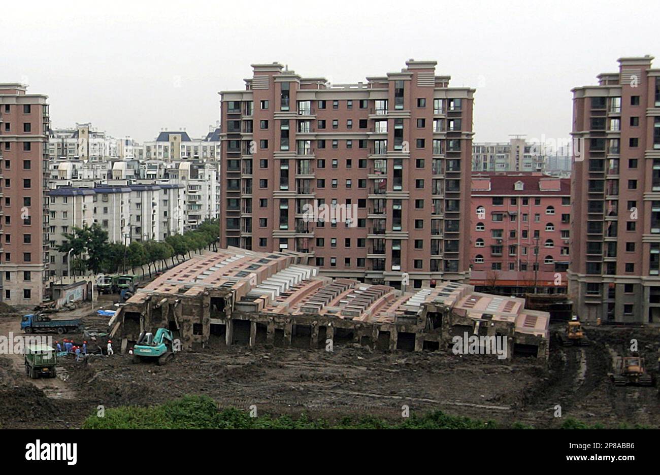 In this photo taken Monday, June 29, 2009, a collapsed 13-story ...