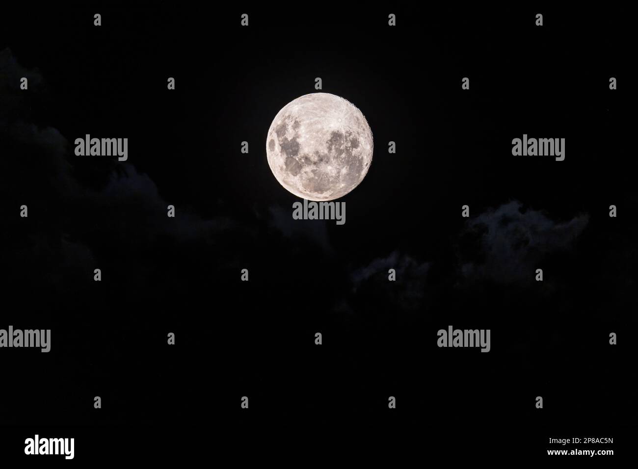 Earth's lunar moon is a permanent natural satellite, seen in the sky ...