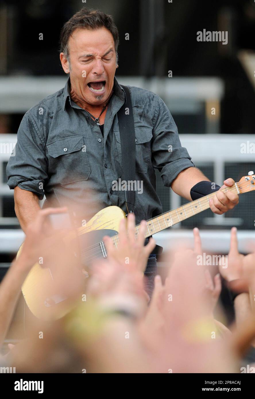 U.S. rock singer Bruce Springsteen sings in front of spectators during ...