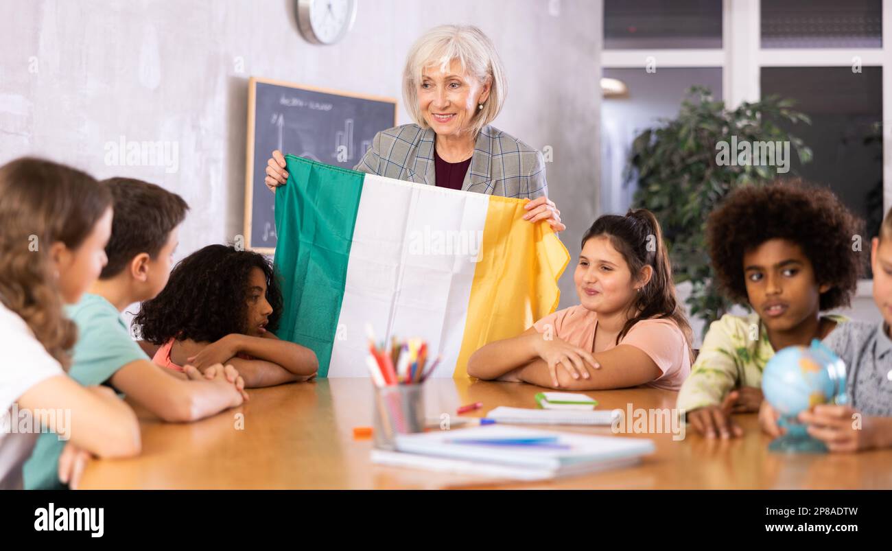 Qualified female teacher tells pupils the history of Ireland Stock ...