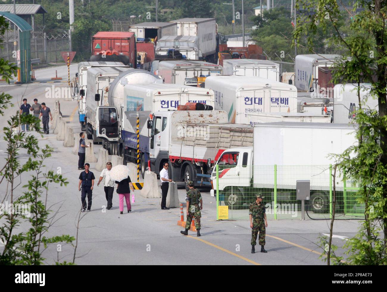 South Korean cargo trucks wait to head to the North Korean city of ...