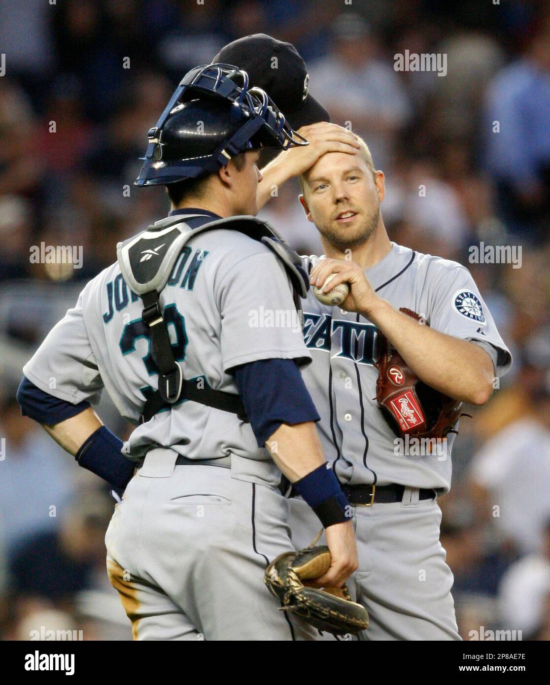 Seattle Mariners catcher Rob Johnson stands with pitcher Jarrod ...