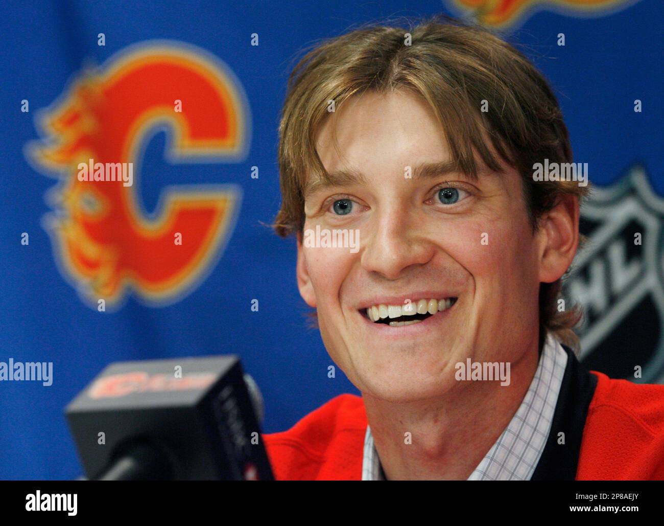 New Calgary Flames defenseman Jay Bouwmeester smiles during a news ...