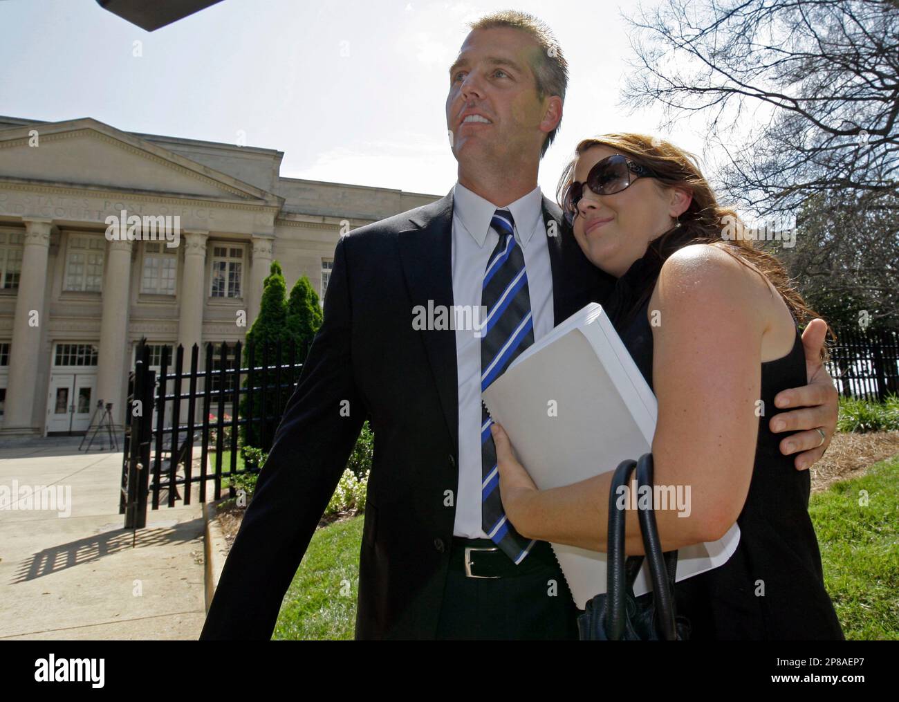 NASCAR driver Jeremy Mayfield, left, embraces his wife, Shana, right ...