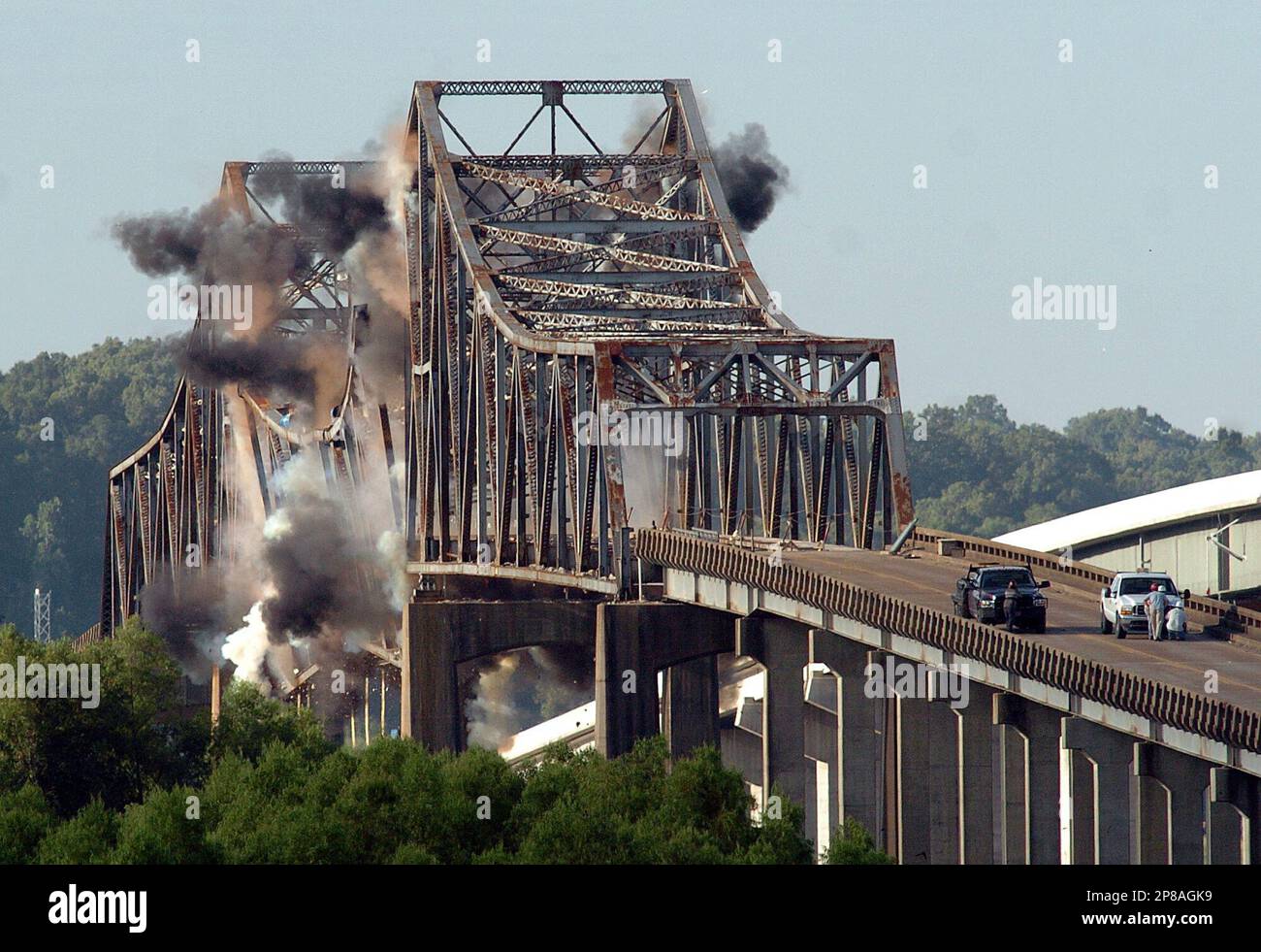 The center span of the 1950 Yazoo River Bridge at Redwood is dynamited ...