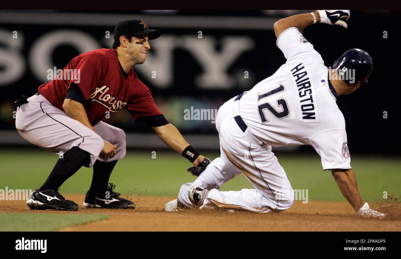 San Diego Padres' Scott Hairston (12) beats the tag of Houston Astros ...