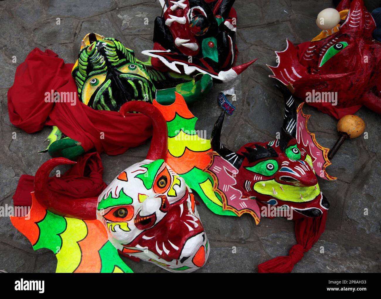 In this photo taken June 11, 2009, devil masks sit on the ground during ...