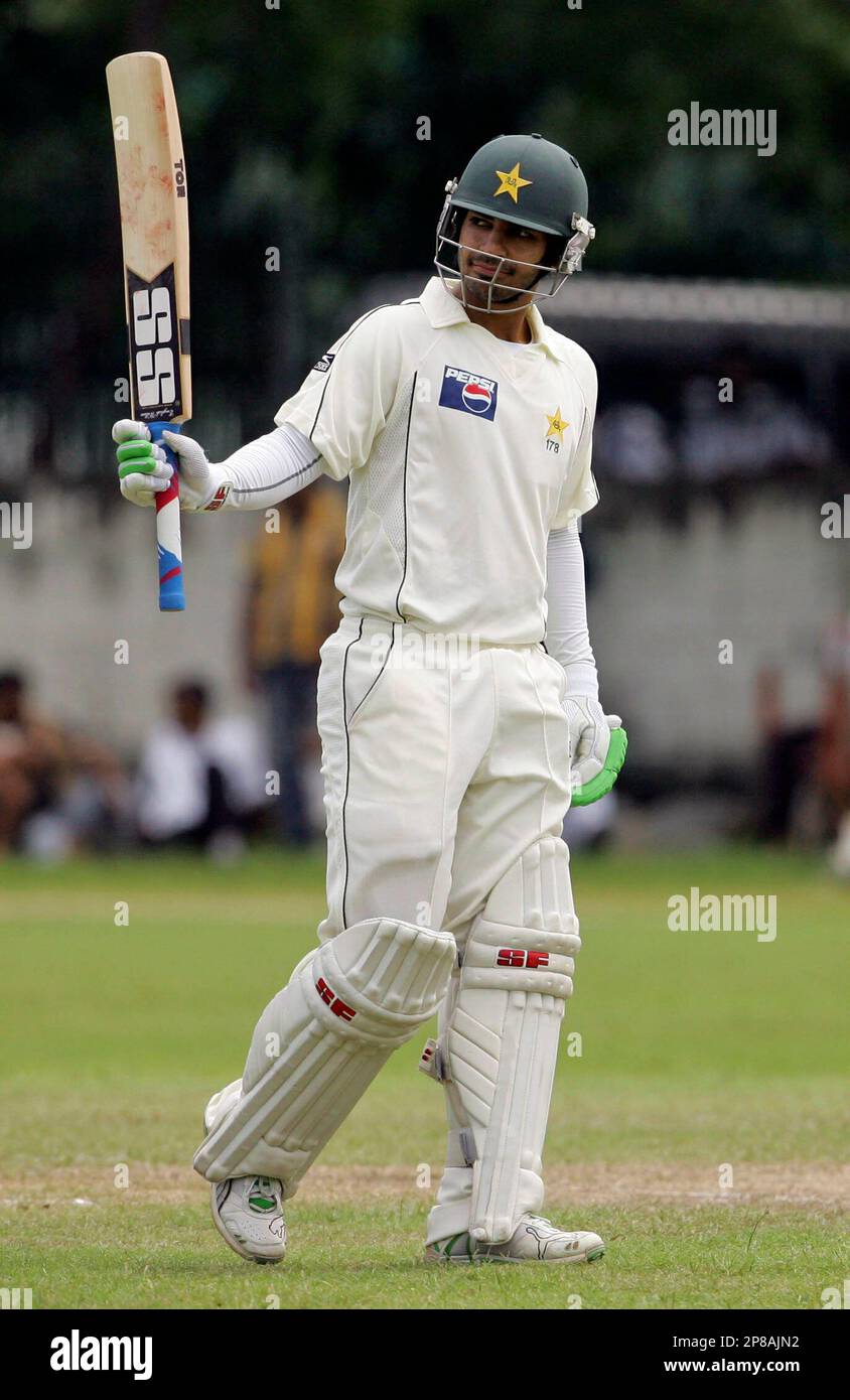 Pakistani cricketer Salman Butt raises his bat after completing a half ...