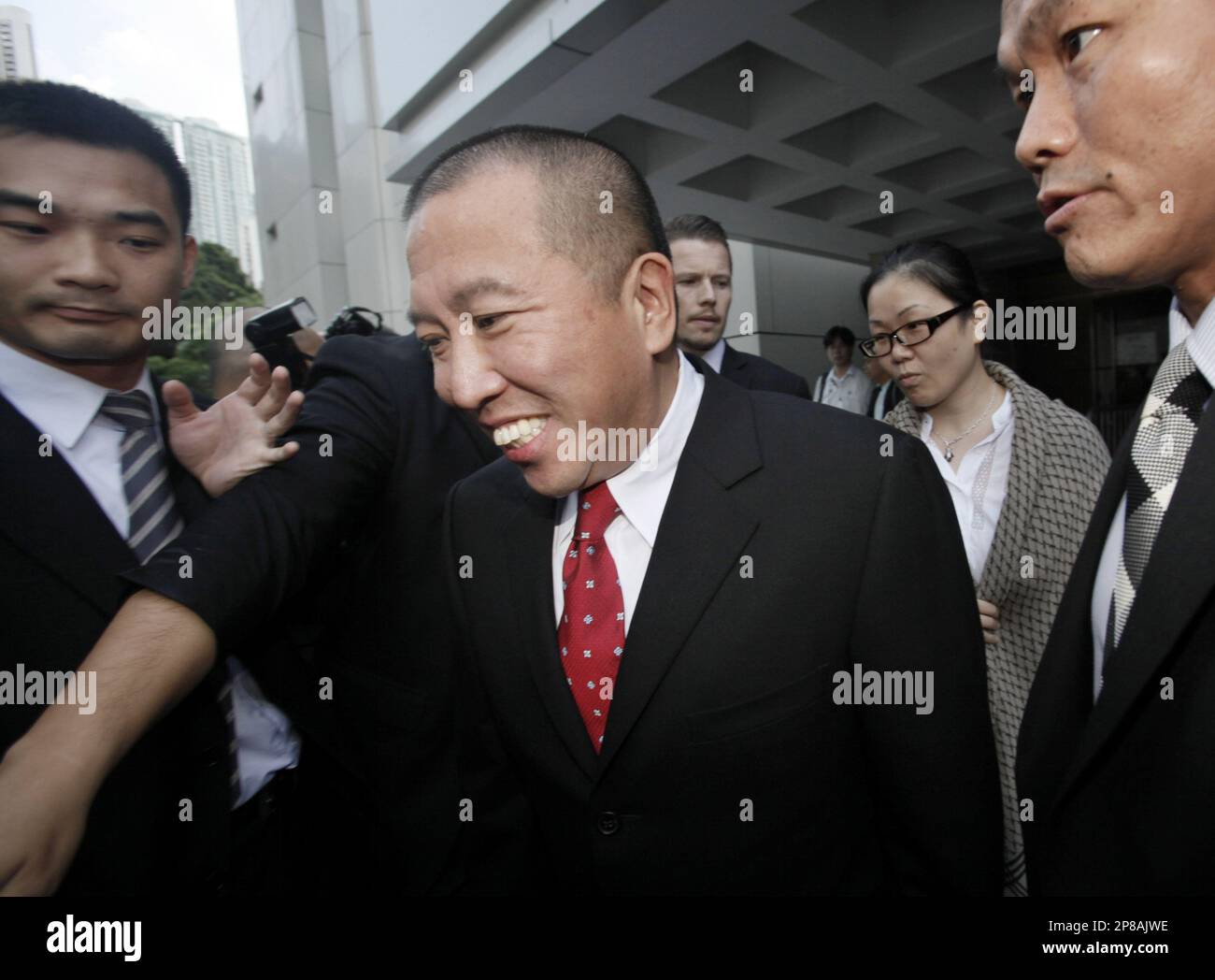 Feng shui adviser Tony Chan Chun-chuen, center, appears in a Hong Kong ...