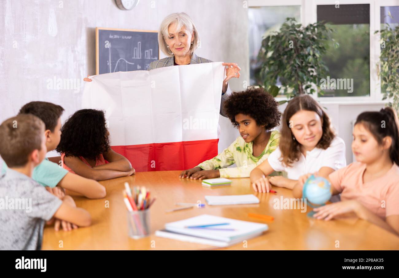 Mature woman teacher tells hi-res stock photography and images - Alamy