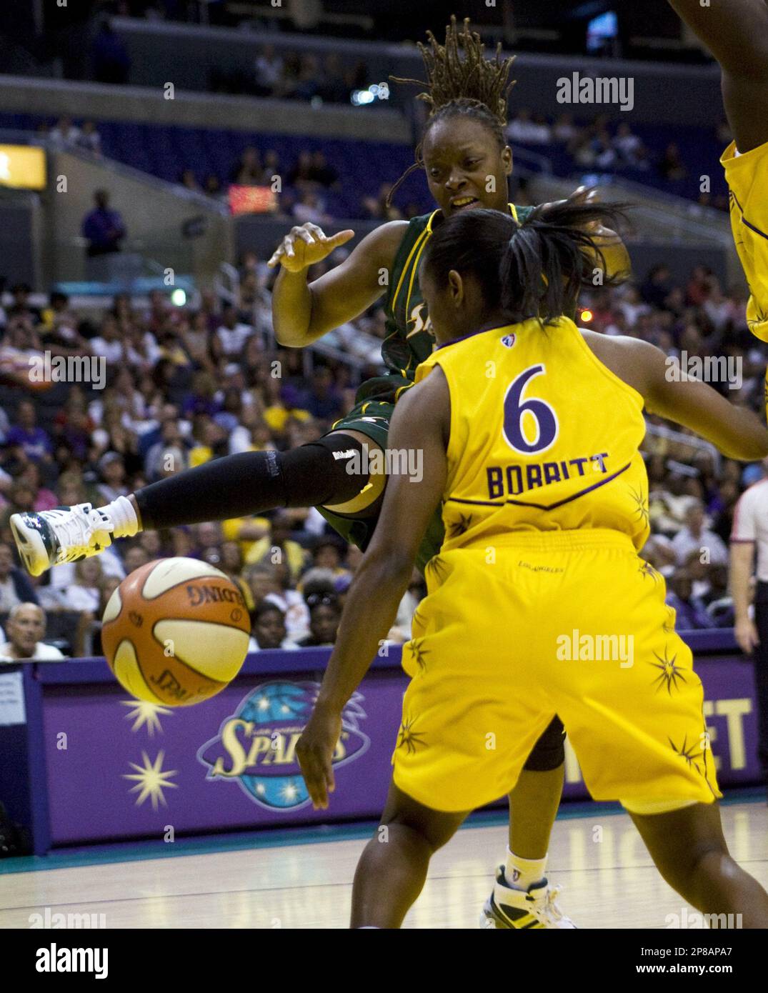 Seattle Storm's Shannon Johnson, background, loses the ball against Los ...