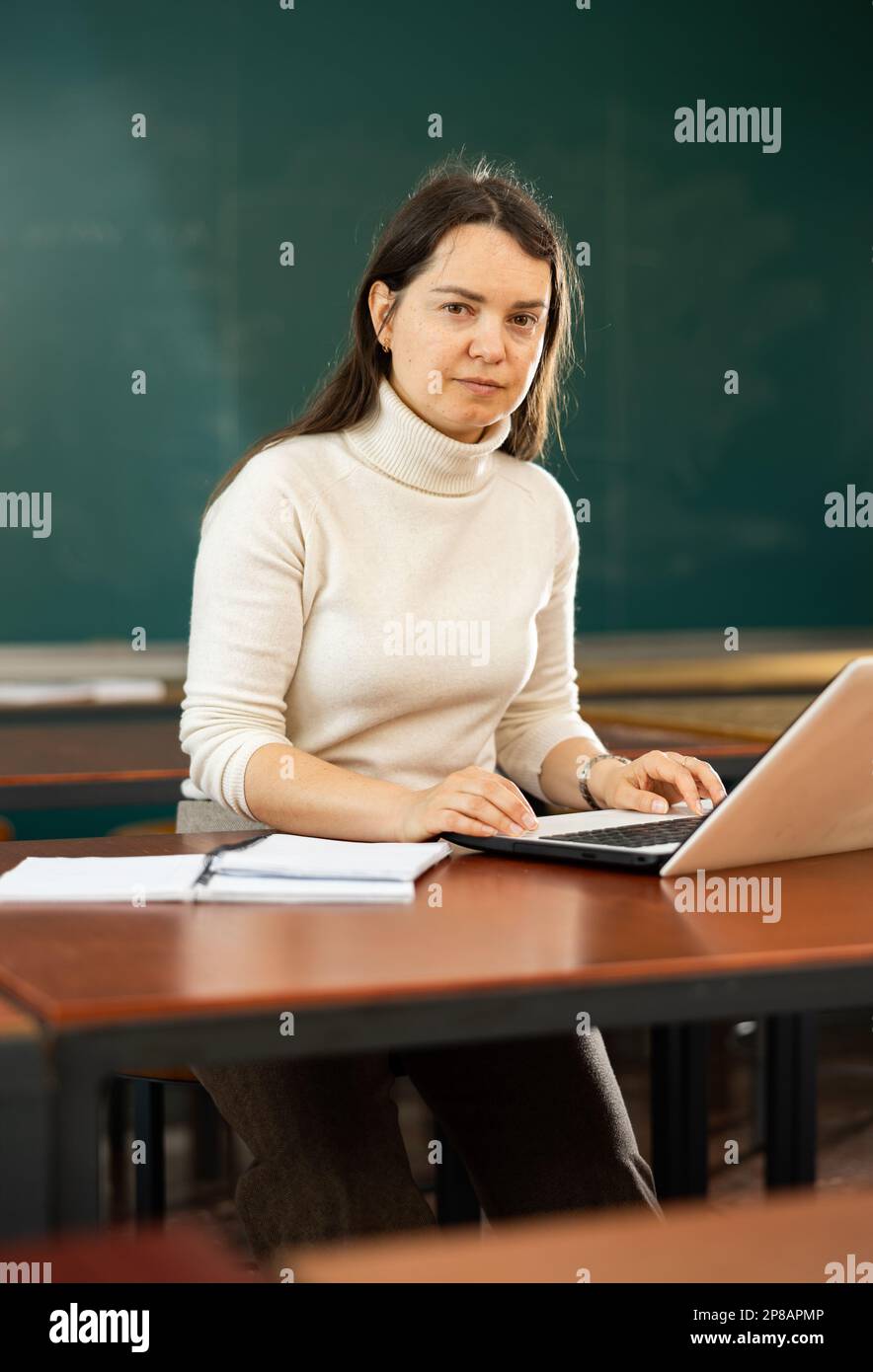 Adult female student preparing for exams in university classroom Stock ...