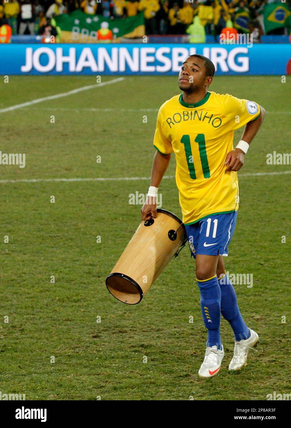 Brazil's Robinho carries a drum following their Confederations Cup ...