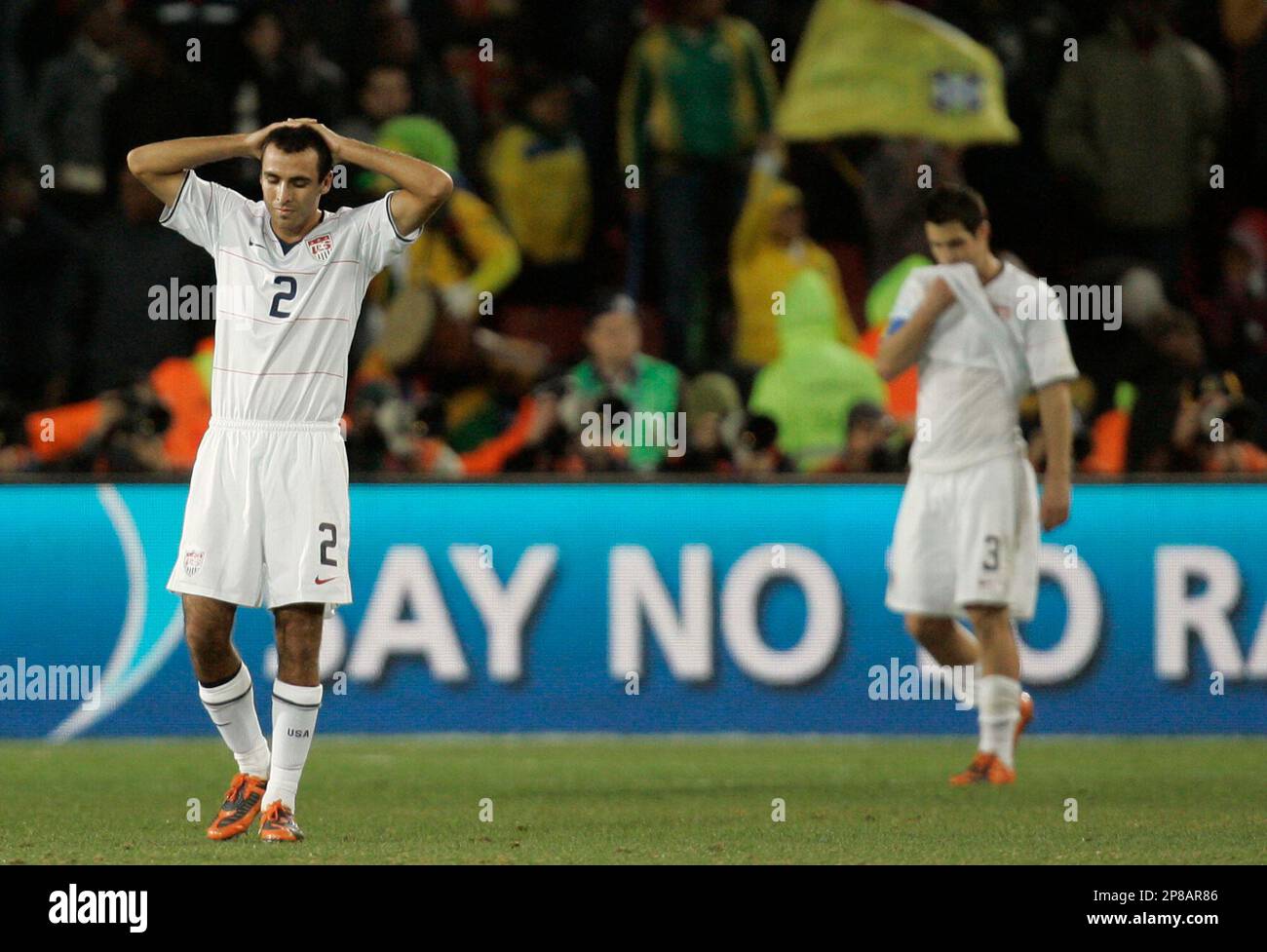 USA's Jonathan Bornstein, left, and teammate Carlos Bocanegra react ...