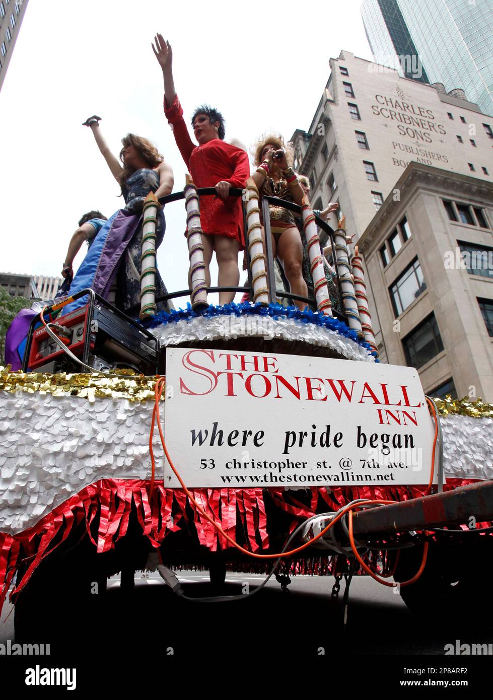 Drag Queens Wave From A Float That Honors The 40th Anniversary Of The