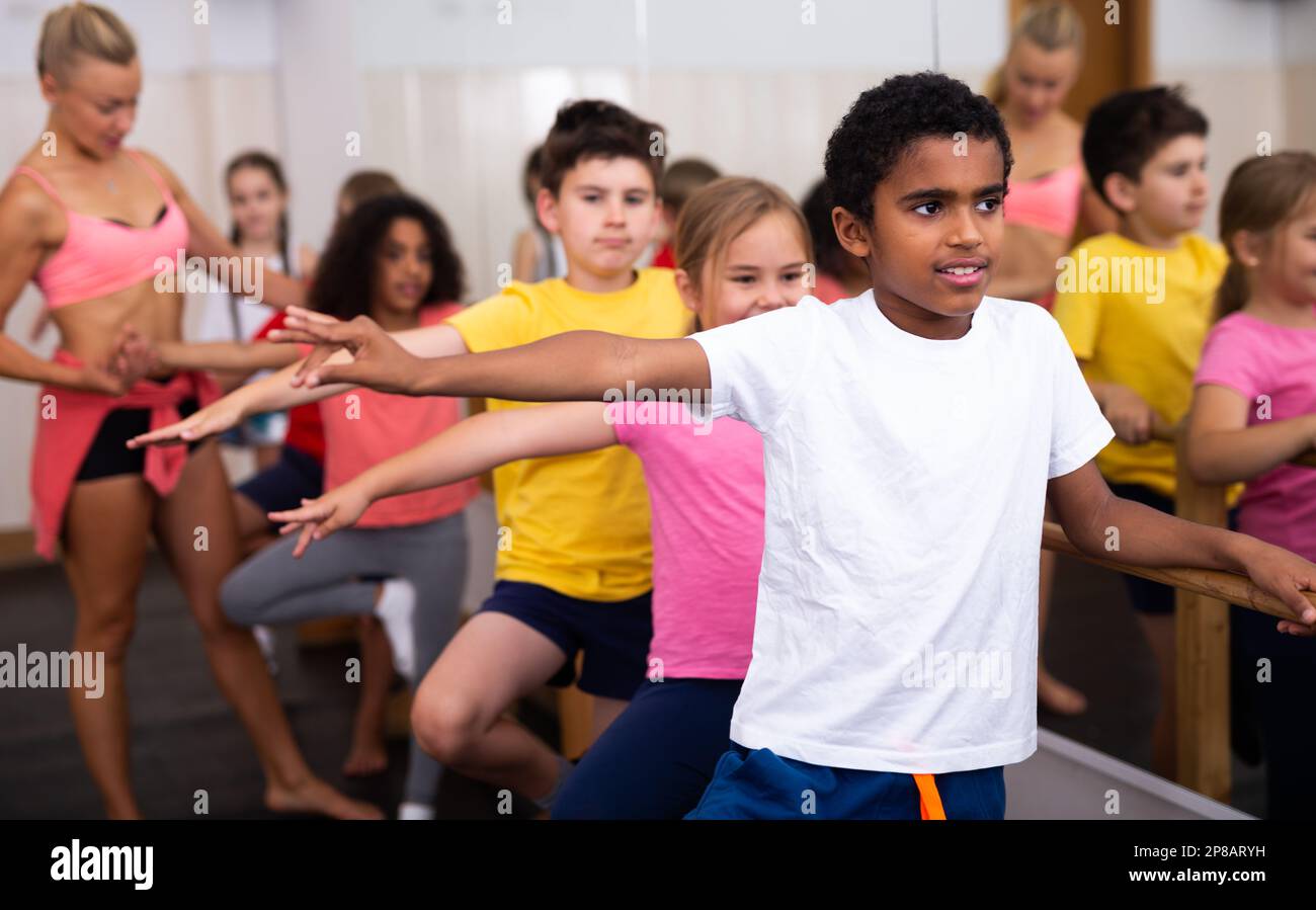 African boy practicing dance moves near ballet barre Stock Photo - Alamy