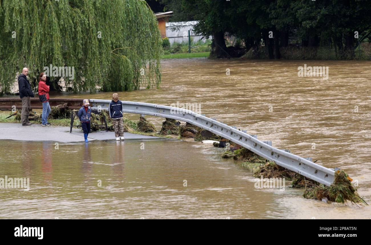 Residents check the level of river Blanice in the village of Husinec ...