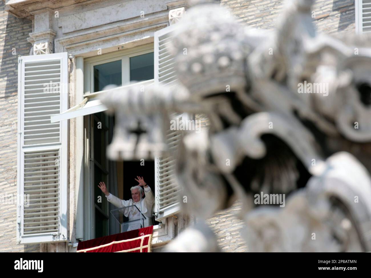 Pope Benedict XVI delivers his blessing during the Angelus noon prayer ...