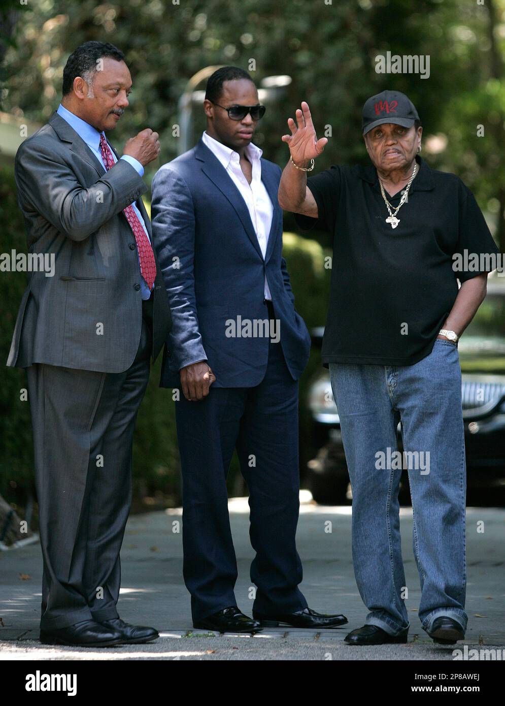 Joe Jackson, father of the late pop star Michael Jackson, right, waves ...