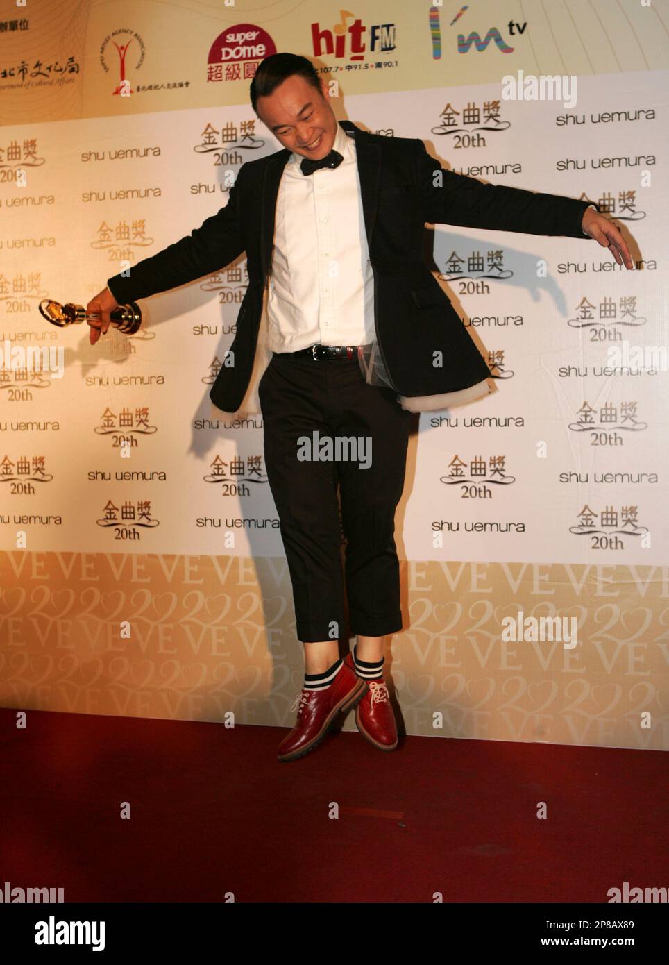 Hong Kong singer Eason Chan jumps in the air after winning the Best ...