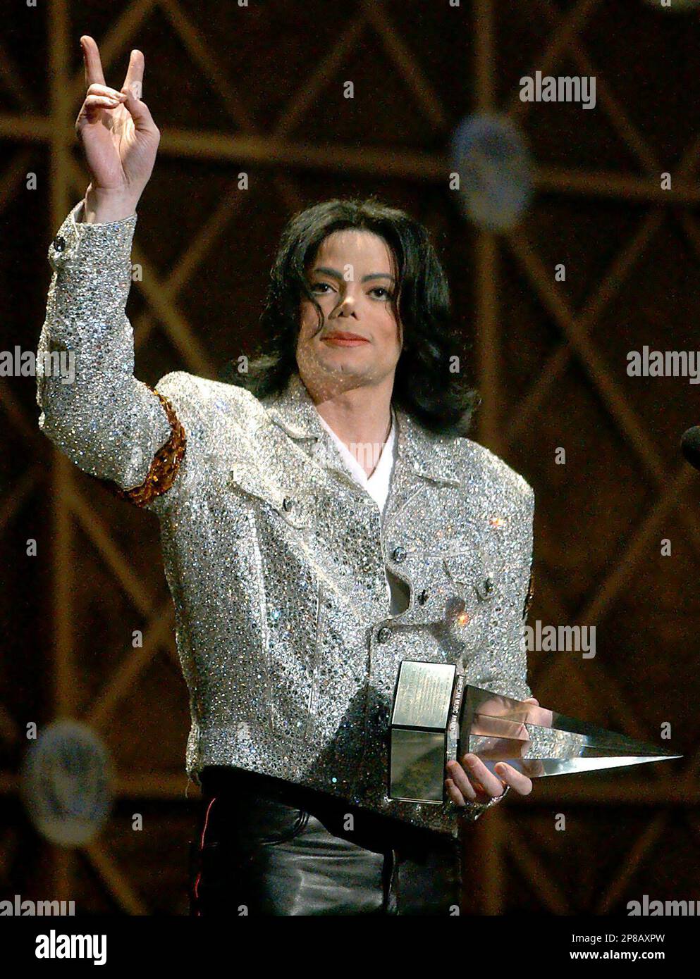 FILE-This Jan 9, 2002 file photo shows Michael Jackson accepting his ...