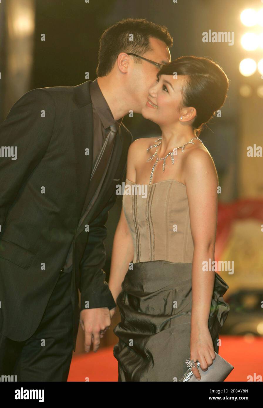 Malaysia singer Fish Leong, right, kissed by her betrothed Tony as they ...