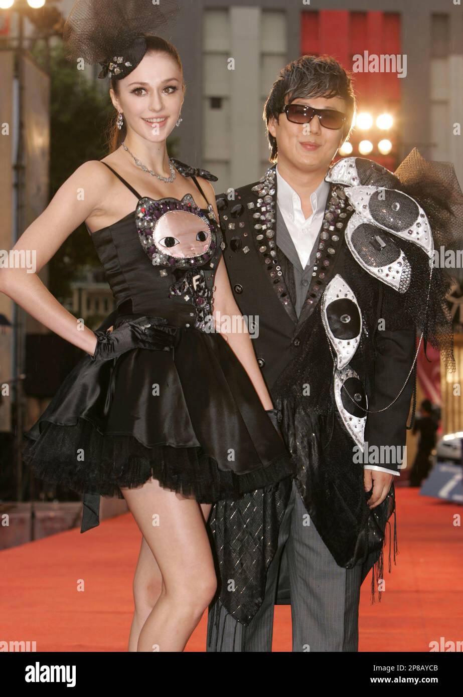Taiwanese singer Ricky Hsiao, right, and model Rysa arrive at the 20th ...