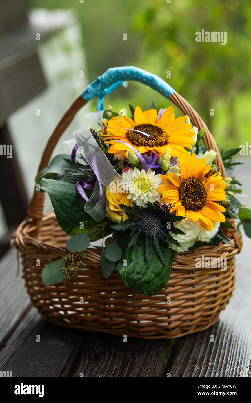Colorful flower bouquet in a basket Stock Photo - Alamy