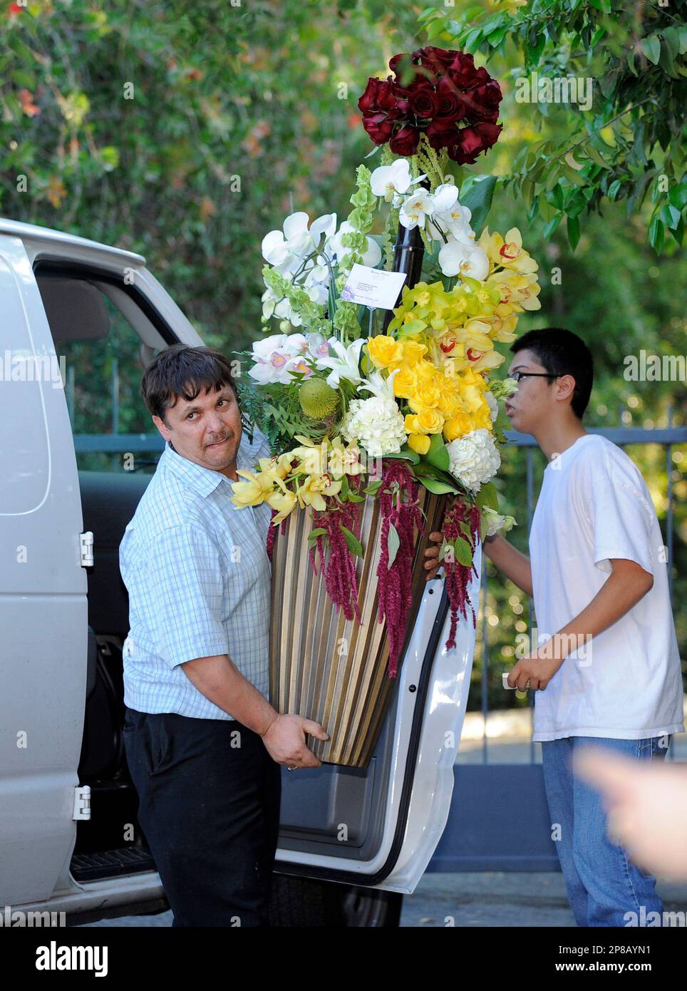 Flowers arrive at the Jackson family residence, Friday, June 26, 2009 ...