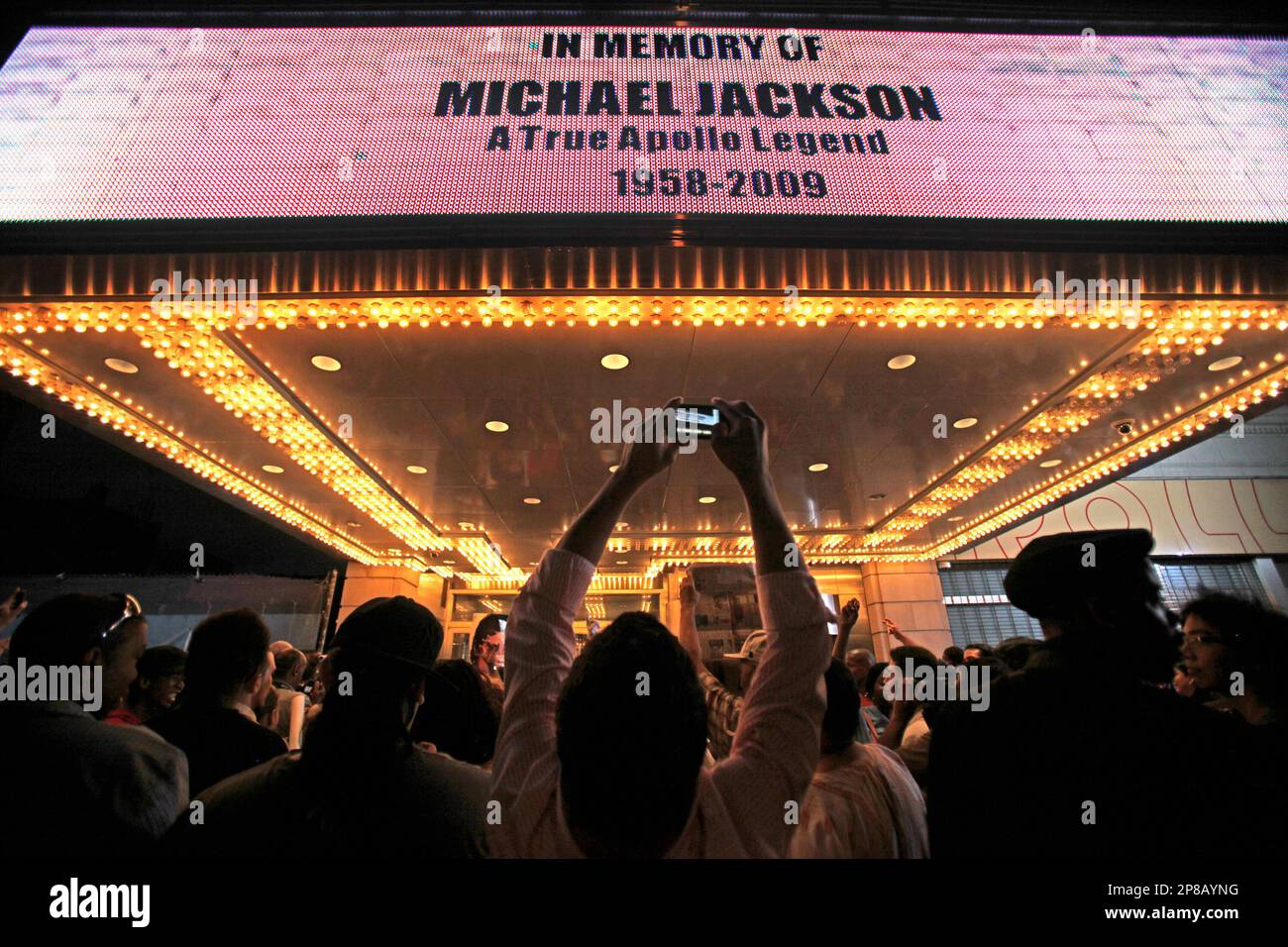 A crowd gathers to sing and dance to the music of Michael Jackson in ...