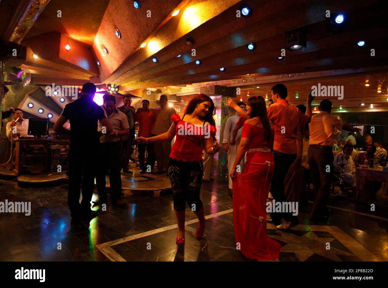 In this photo taken Thursday, June 25, 2009, dancers perform at a ...