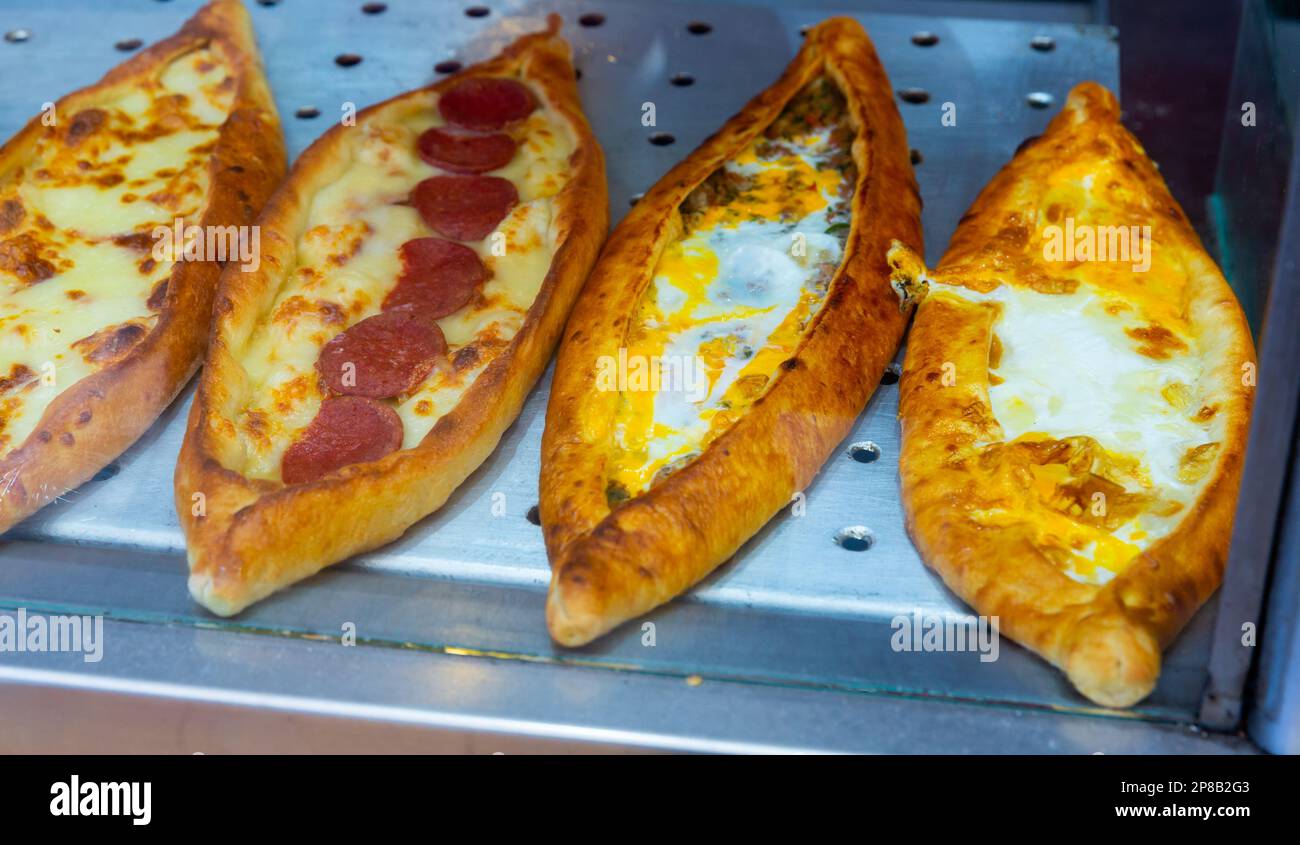 Traditional Turkish pide with various fillings for sale Stock Photo - Alamy