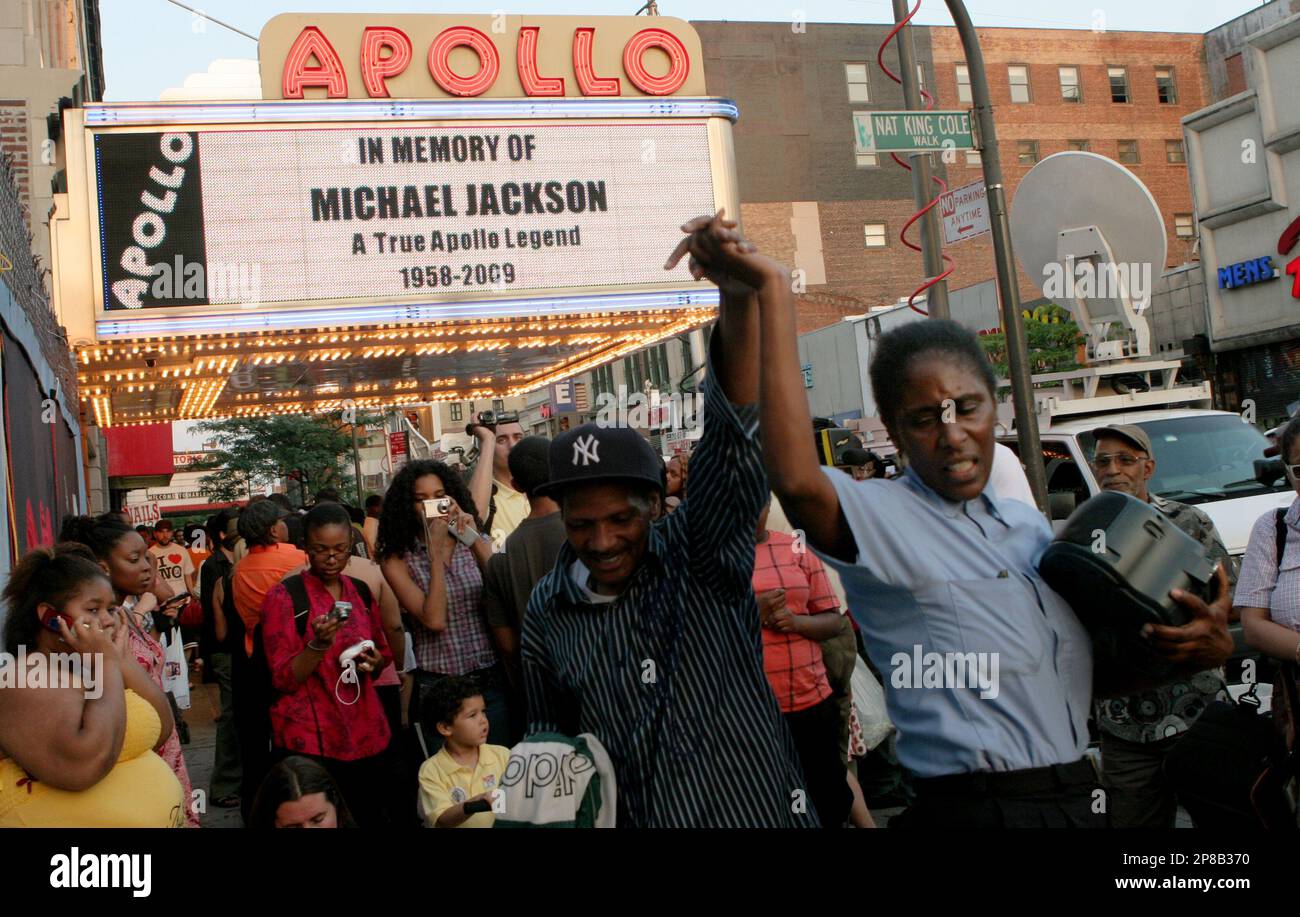 Eleanor Lewis holds on tight to her boom box as she dances to a Michael ...