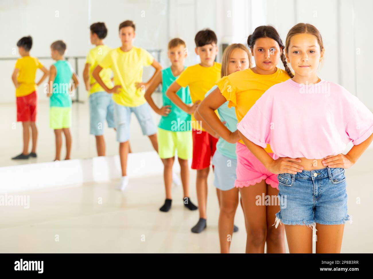Group of kids standing in row in studio Stock Photo - Alamy