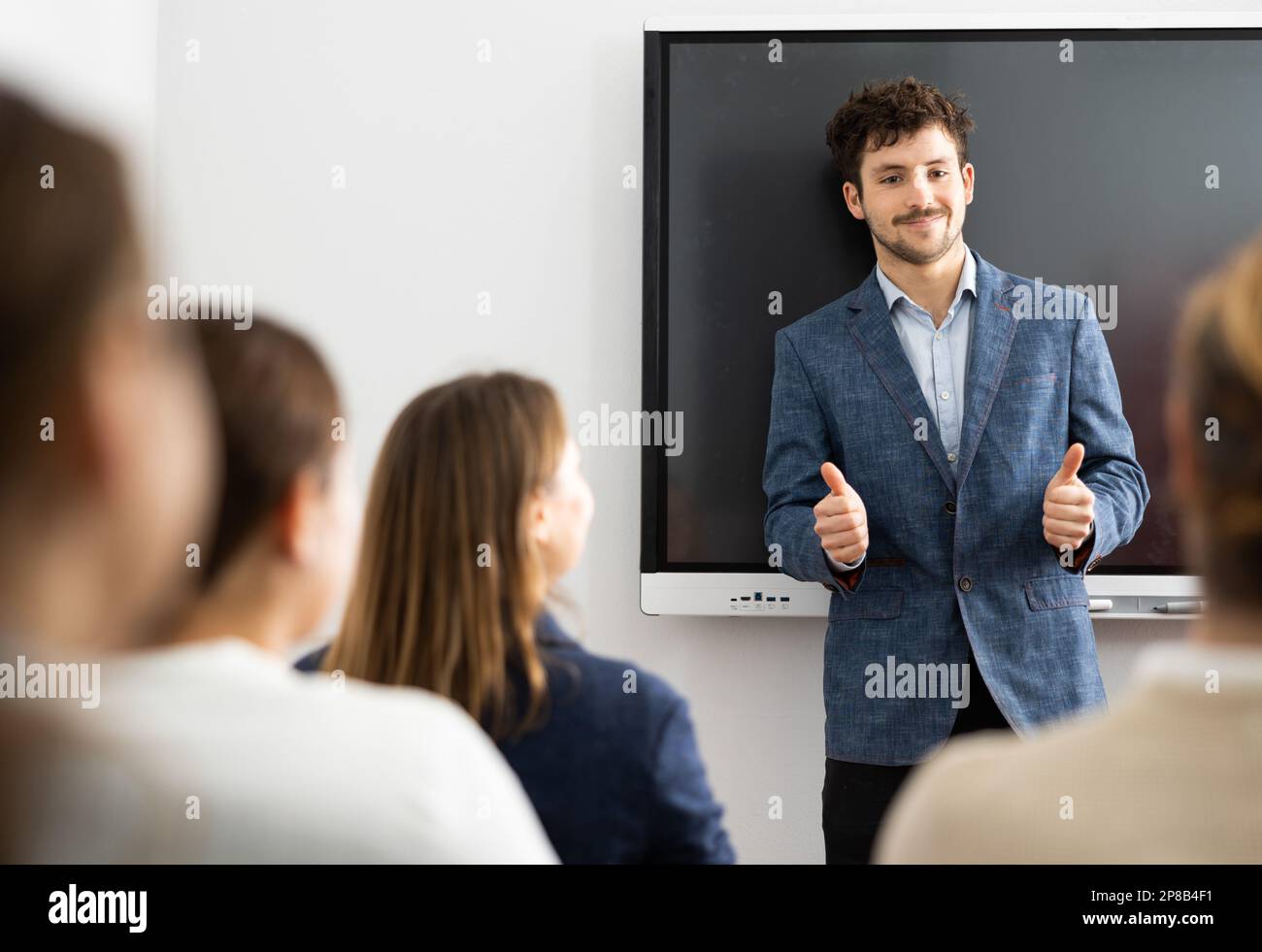 Male teacher explaining subject hi-res stock photography and images - Alamy