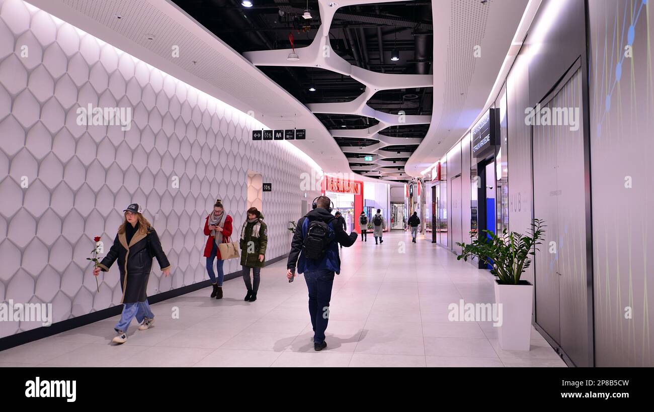 Warsaw, Poland. 8 March 2023. People walking in a shopping mall past ...