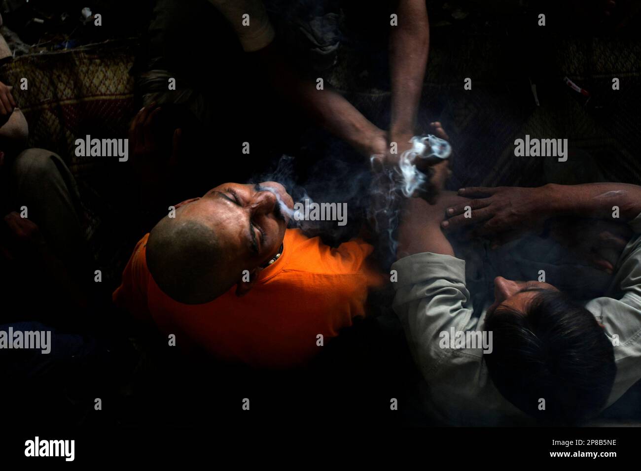 Pakistani addicts smoke hashish in Karachi, Pakistan on Thursday, June ...