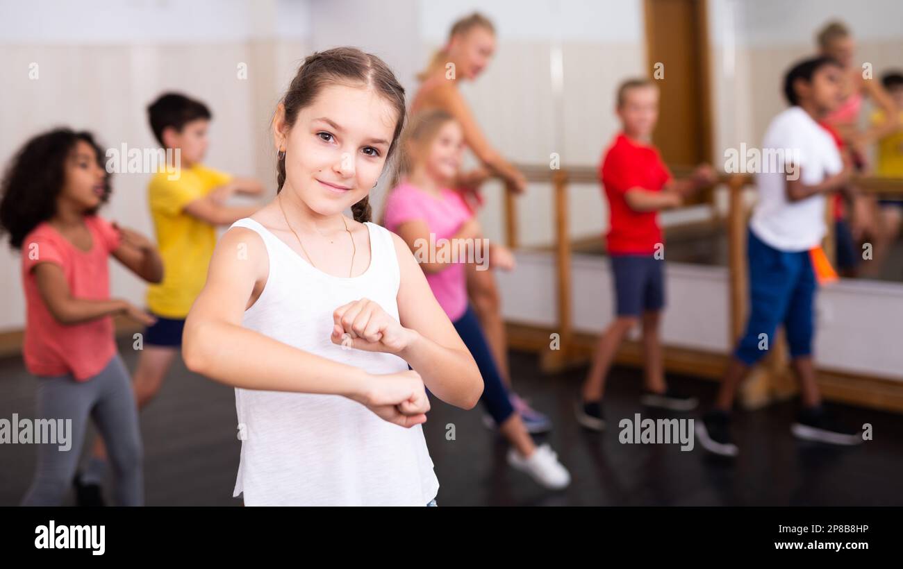 Girl exercising in group during dance class Stock Photo - Alamy