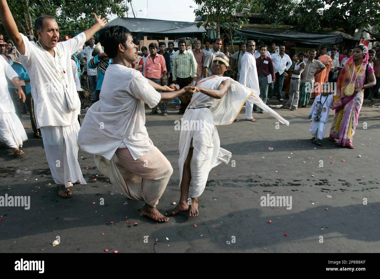 Hindu devotees dance and celebrate during Rathyatra or Chariot Festival ...