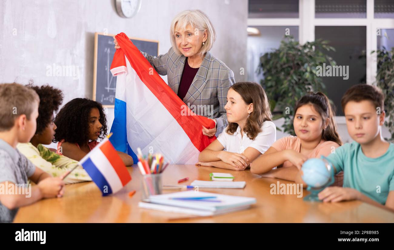 students listen to woman teacher who talks about Netherlands Stock ...