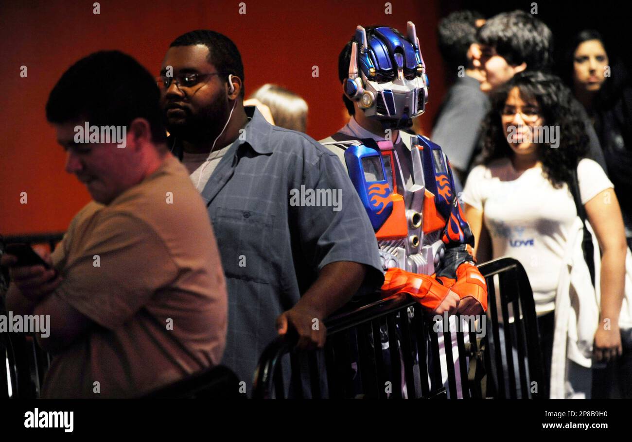 Henry Tsai of Los Angeles, third from left, wears an Optimus Prime ...