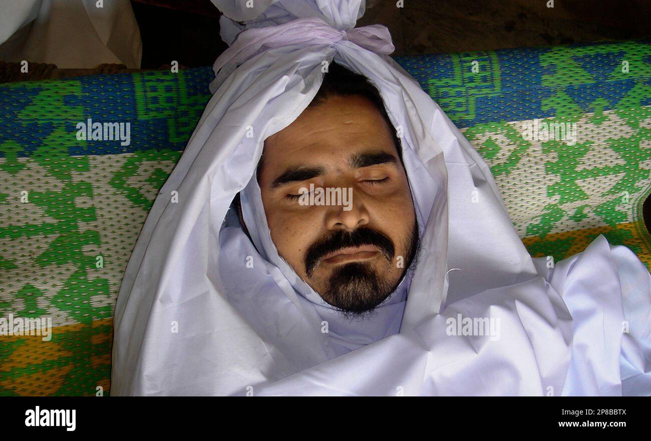 The dead body of Qari Zainuddin, a Taliban faction leader who was ...