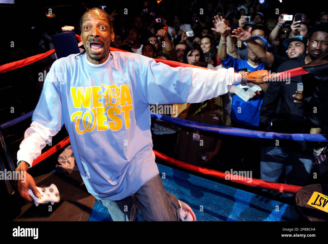 Rapper Snoop Dogg reacts after defeating Mike Tyson in the new boxing ...