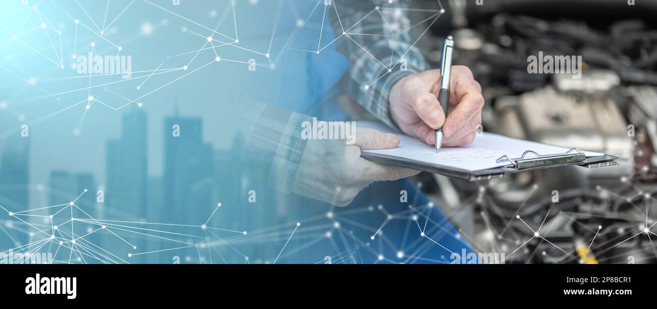 Car mechanic checking a car engine and writing on clipboard; panoramic ...