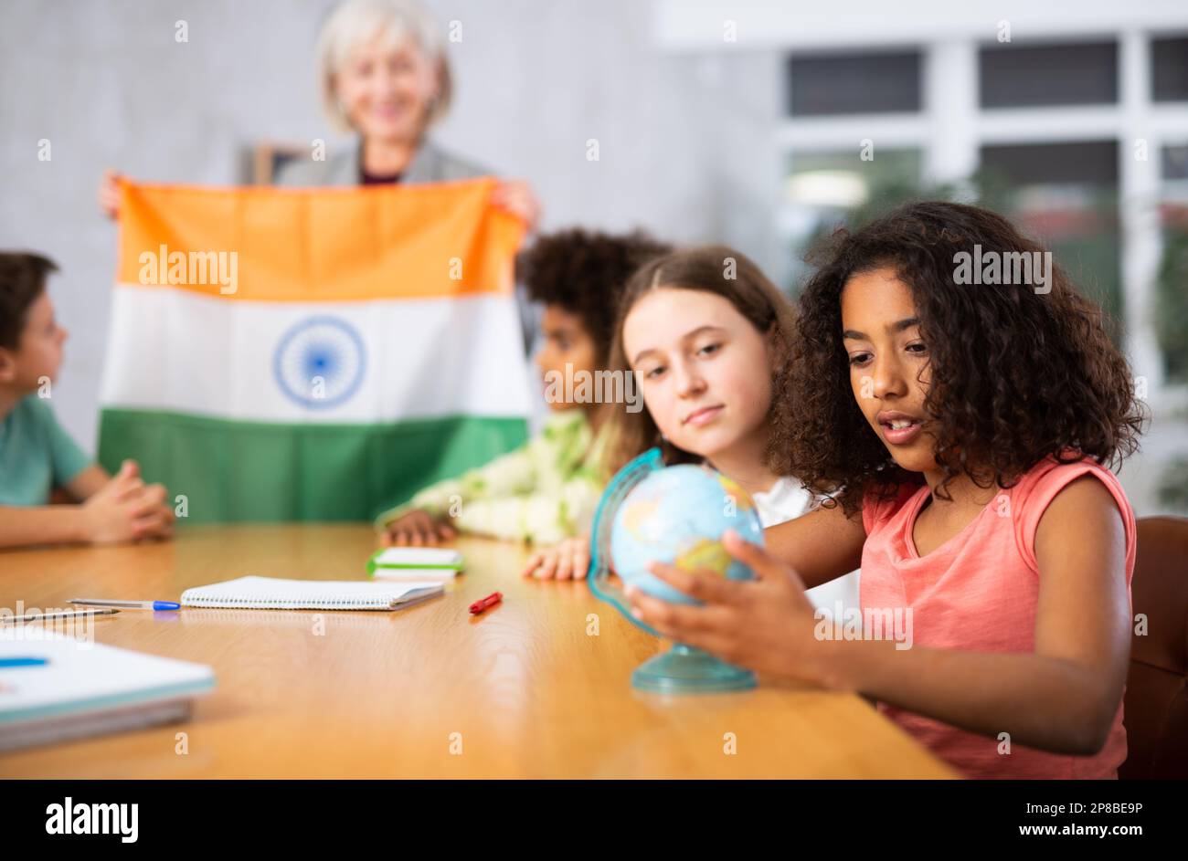 Female teacher showing indian flag to kids in geography class Stock ...